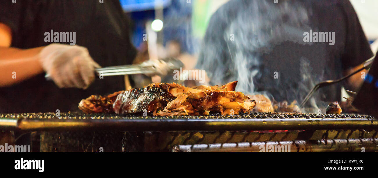 Traditional Thai Street Food, Beef barbecue grill on outdoor fireplace ...