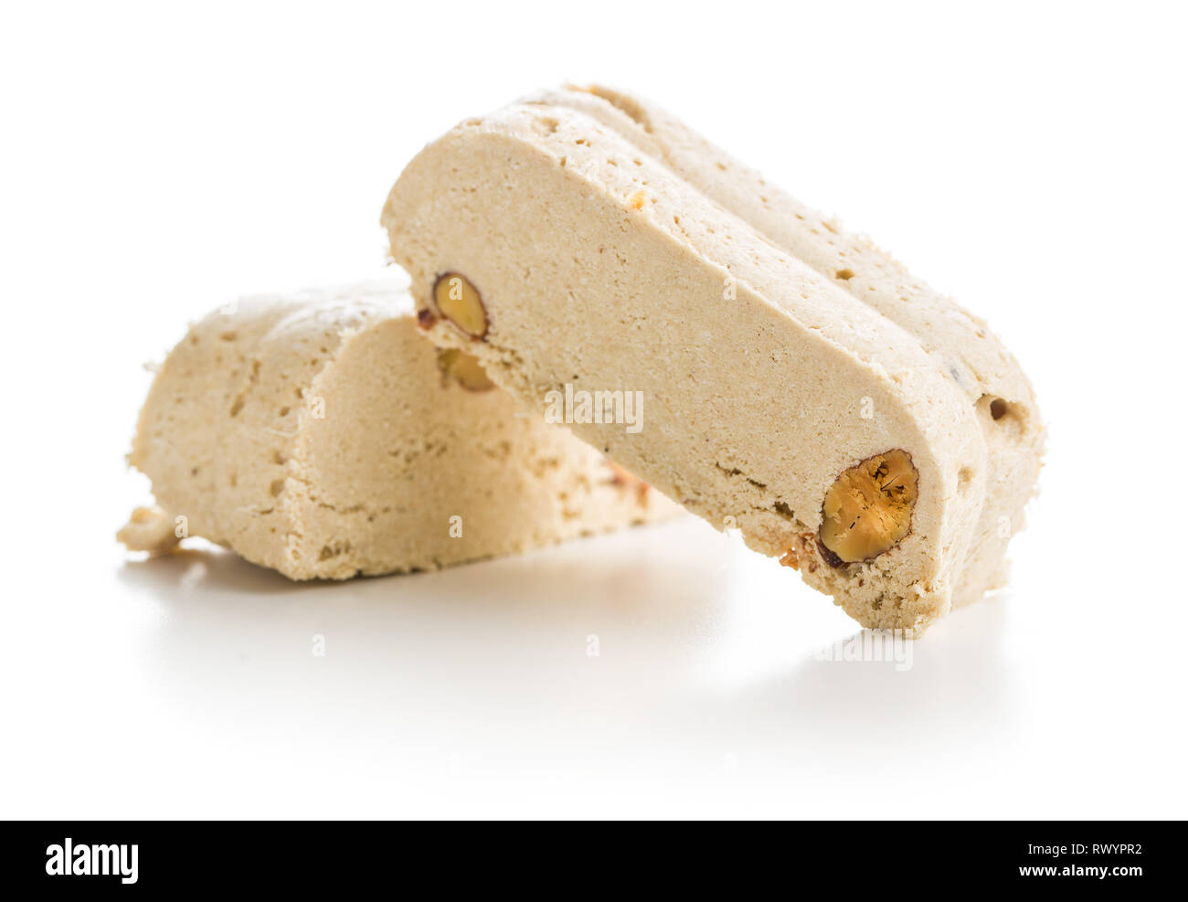 Sweet halva dessert slices with almonds isolated on white background ...