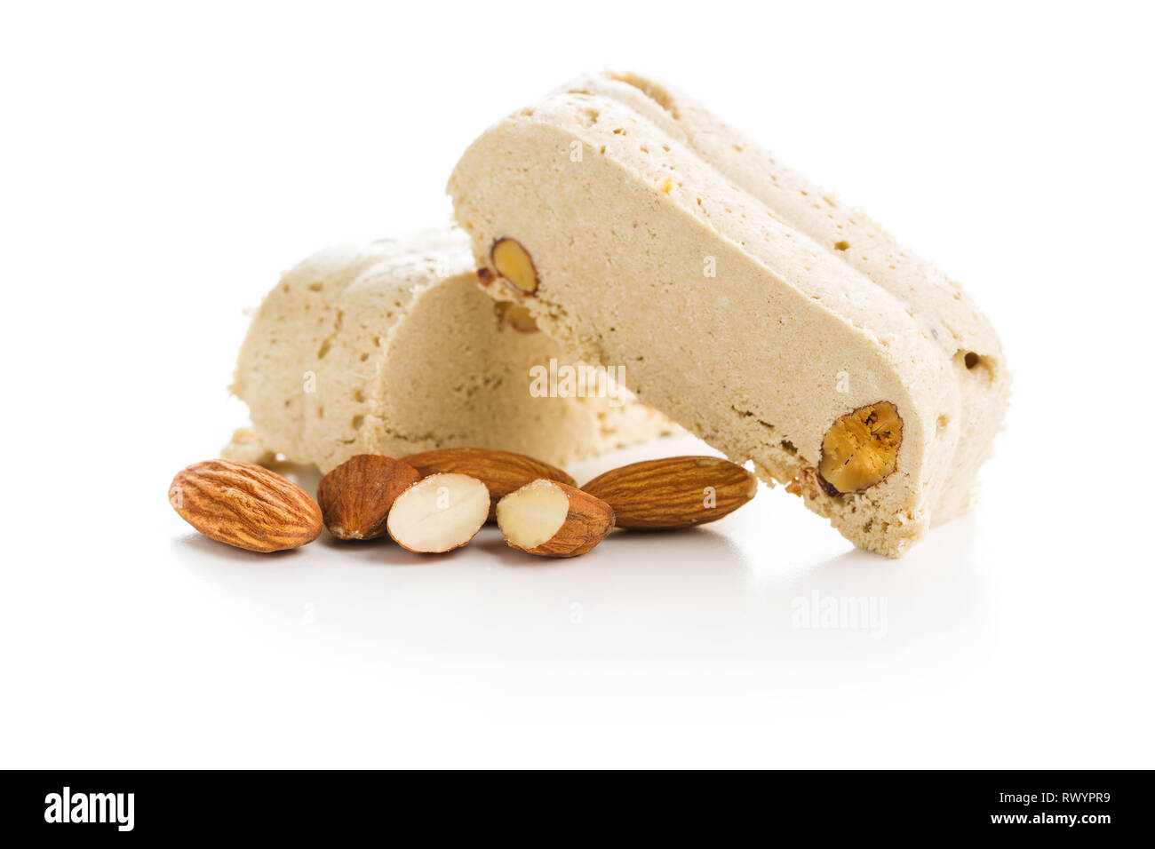 Sweet halva dessert slices with almonds isolated on white background ...