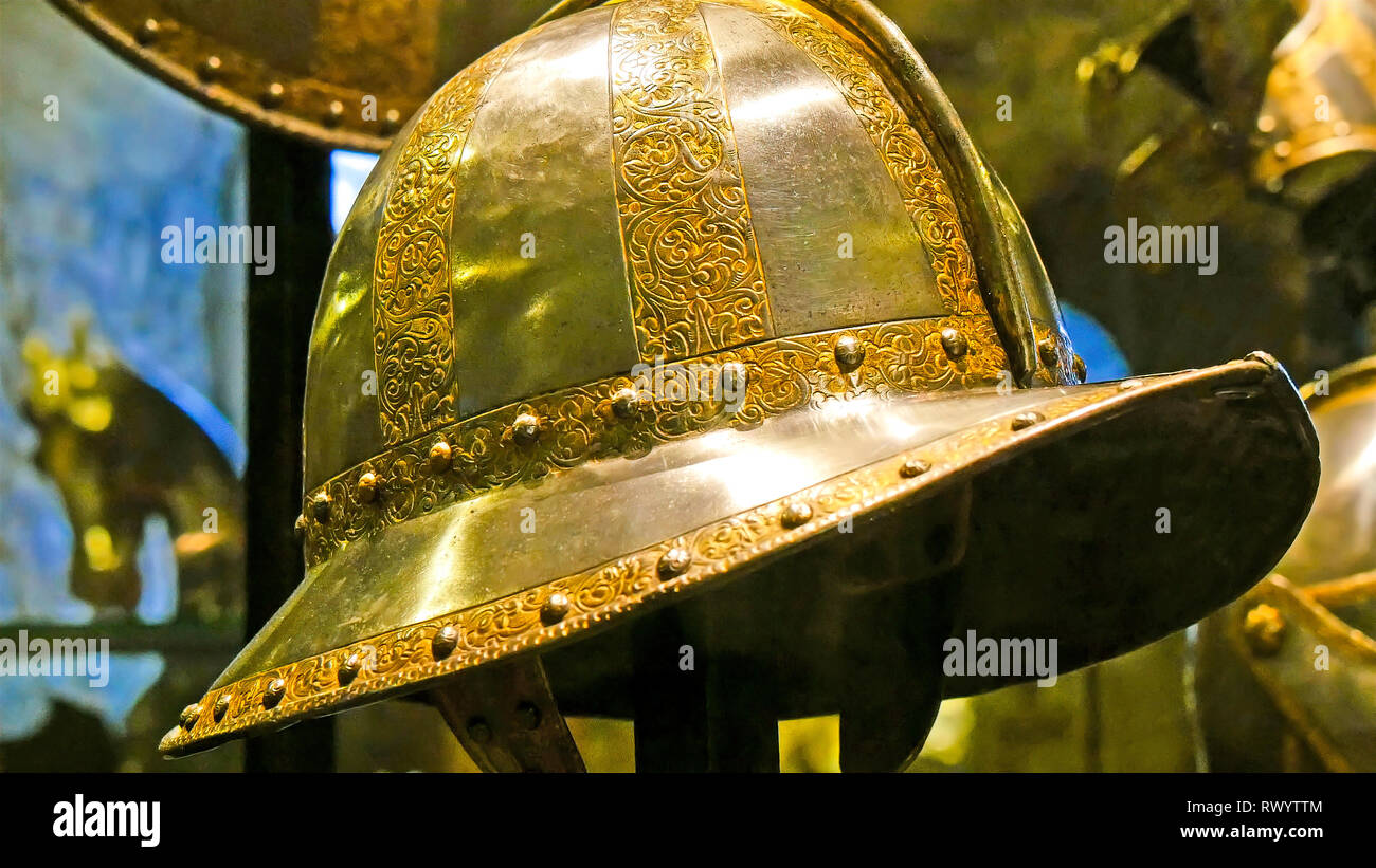 A metal knights hat in the Tower of London. It is hanged on one of the ...