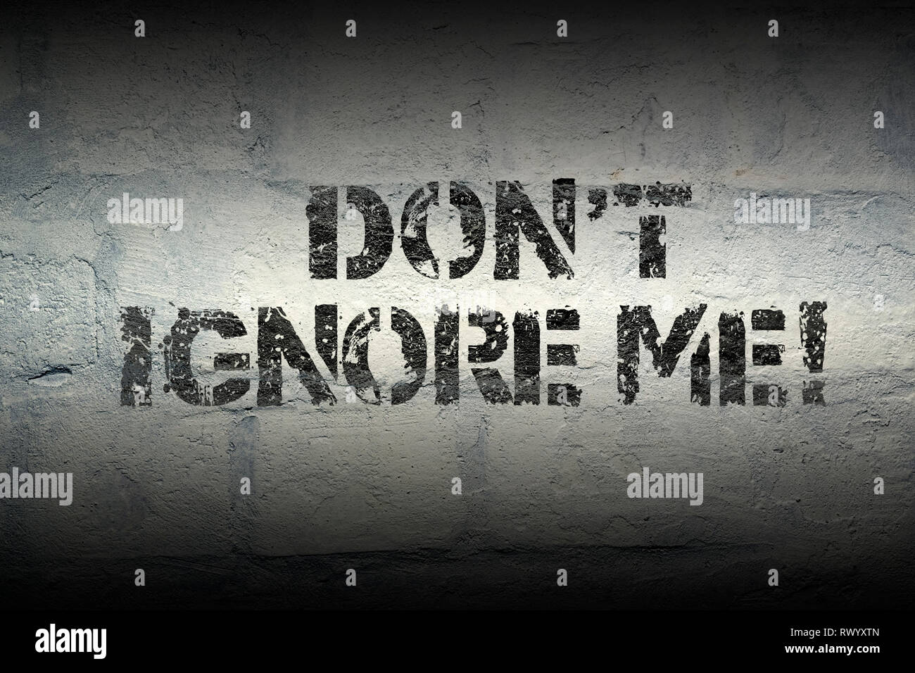 do not ignore me phrase stencil print on the grunge white brick wall ...
