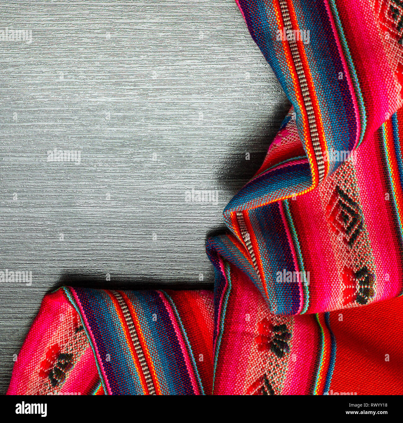 Red pattern tablecloth on wooden table for background. Fabric texture ...