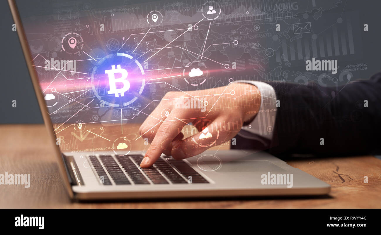 Hand checking on laptop global bitcoin exchange rate concept Stock ...