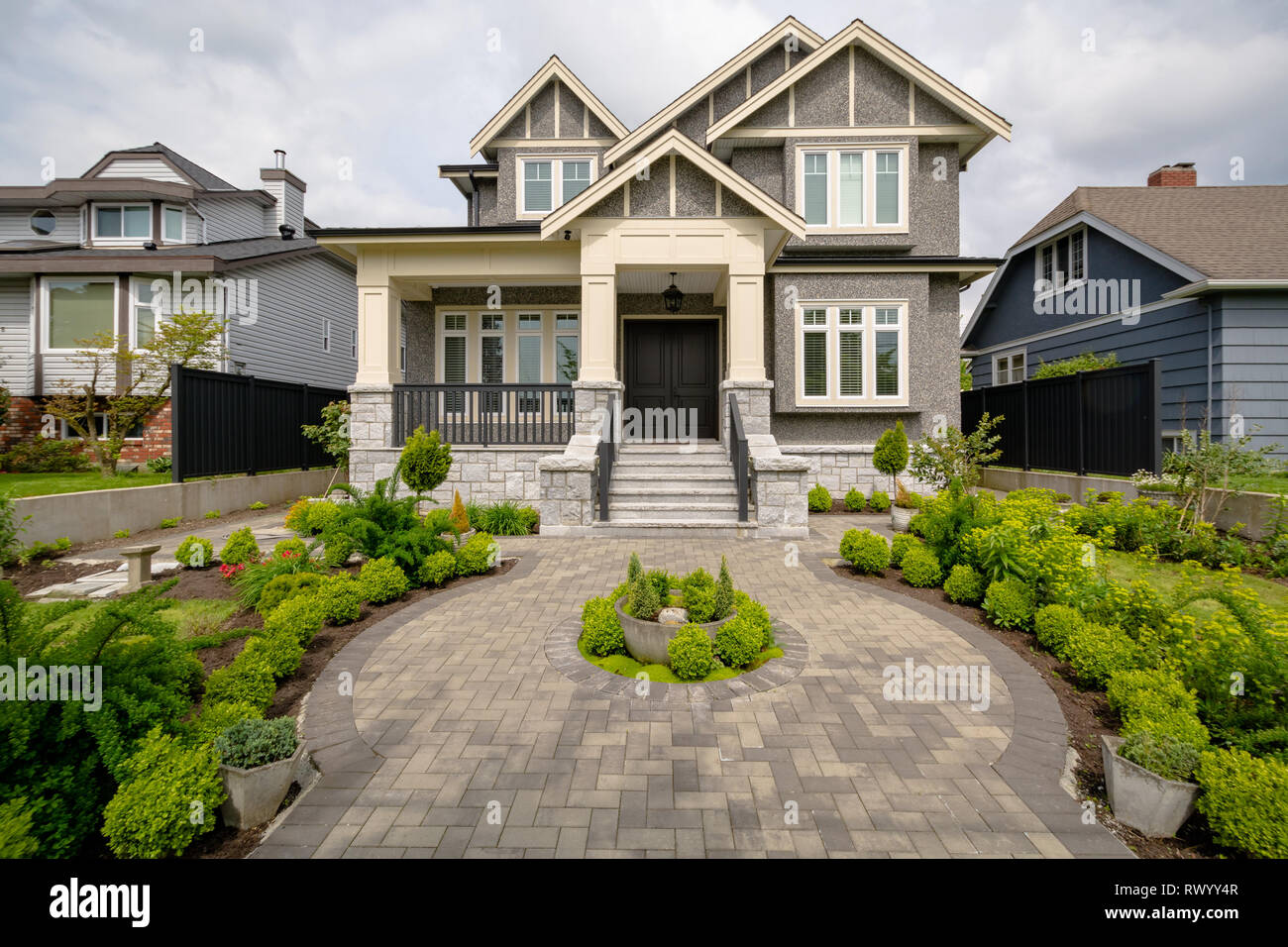 Main entrance of residential house with rounded paved pathway over ...