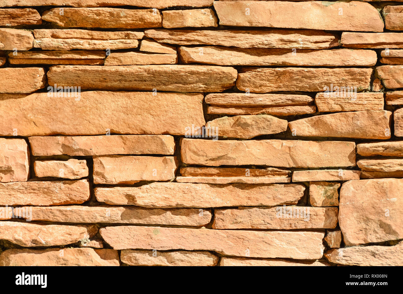 Sand colored stone setting. Stone wall texture Stock Photo - Alamy