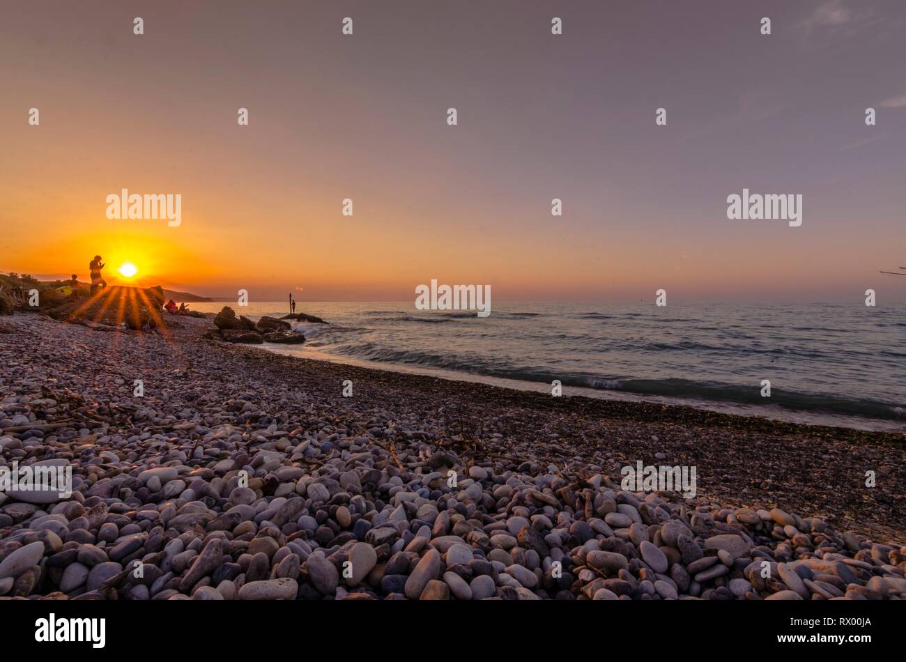 Pebble beach at sunset hi-res stock photography and images - Alamy