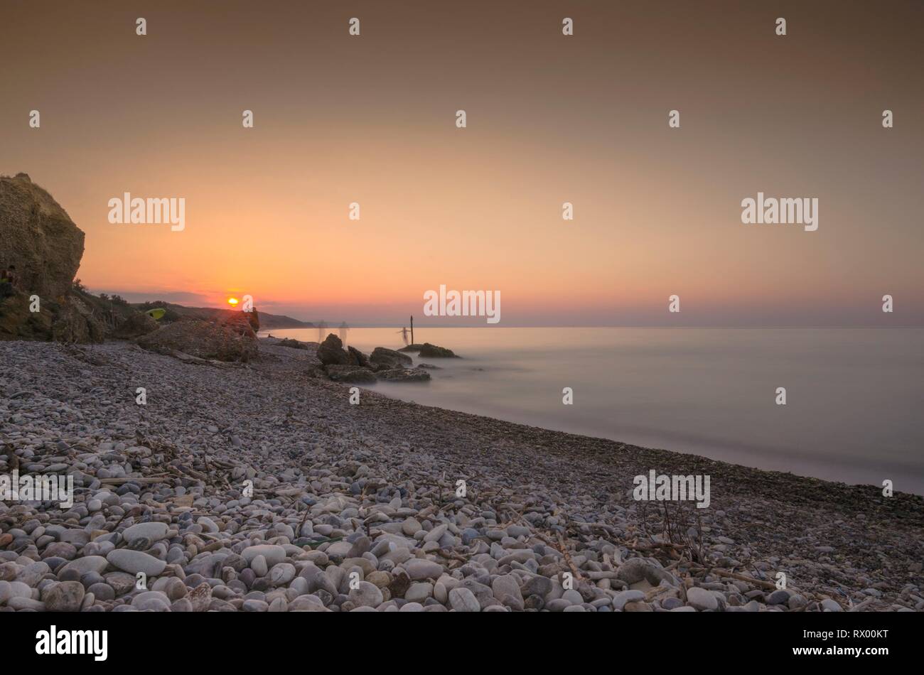 Pebble beach at sunset hi-res stock photography and images - Alamy