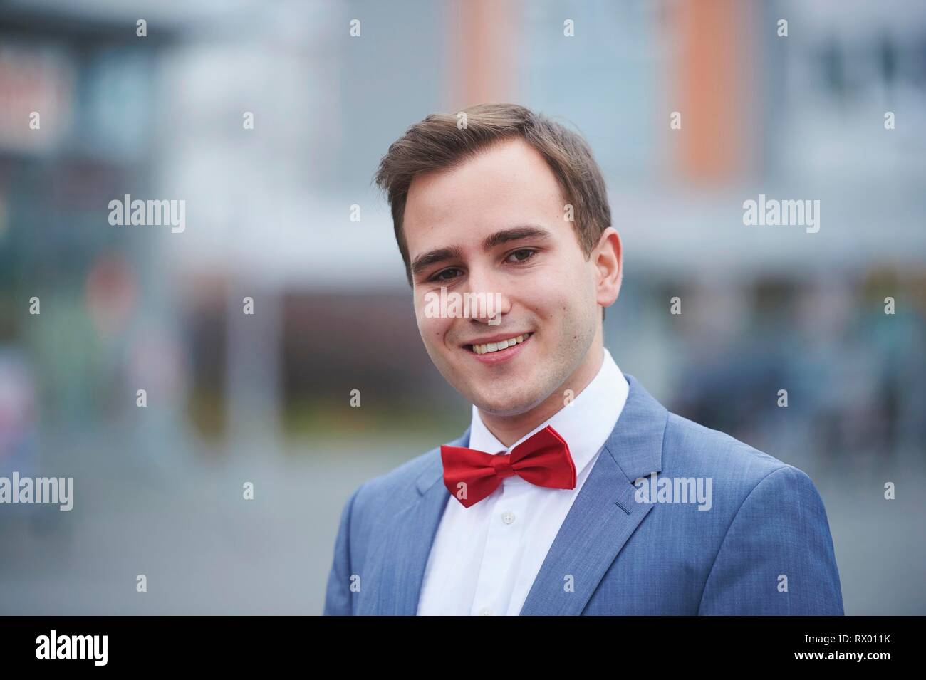 Young business man walking on street, portrait, Germany Stock Photo - Alamy