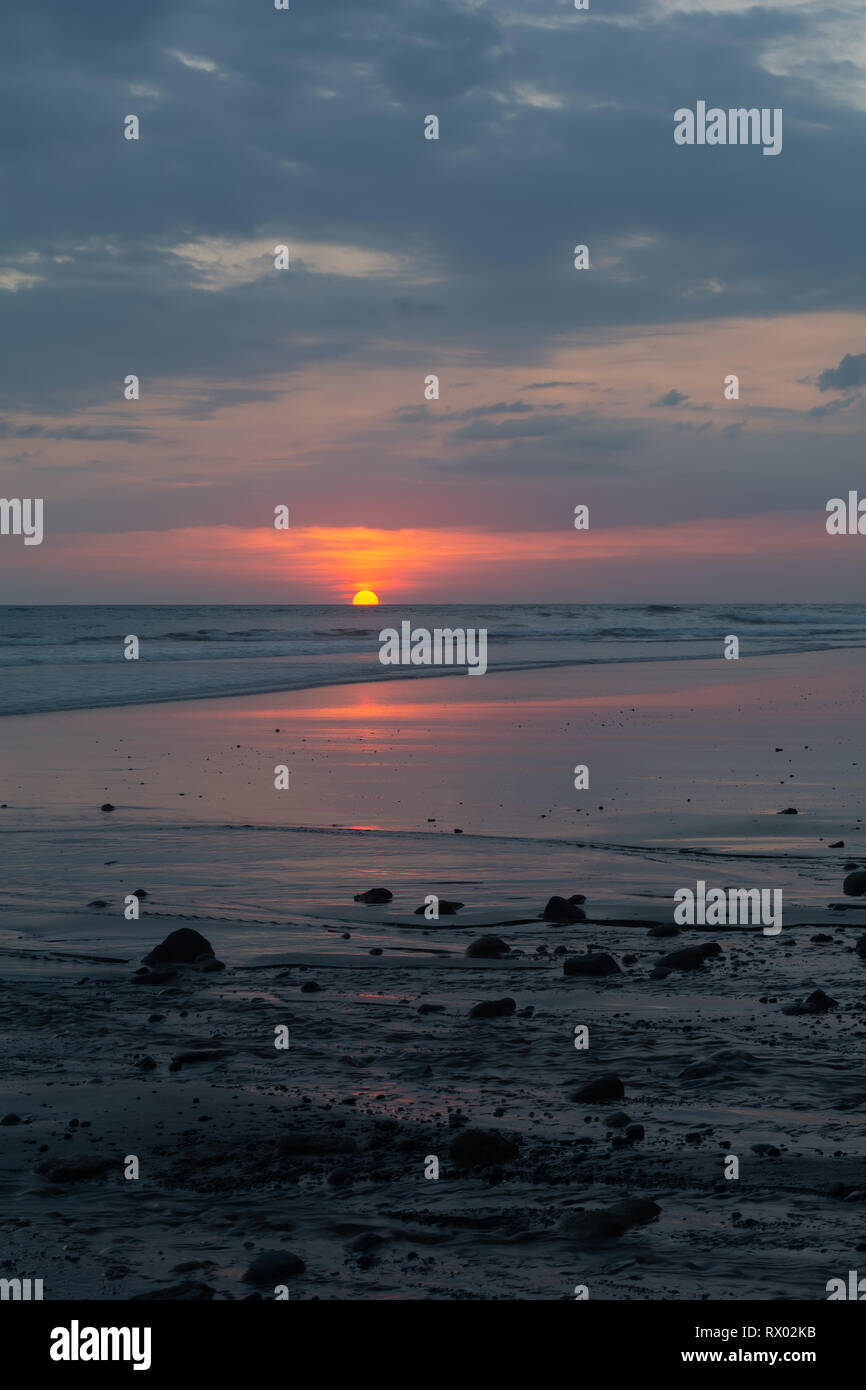 Surf sunset over rocks hi-res stock photography and images - Alamy