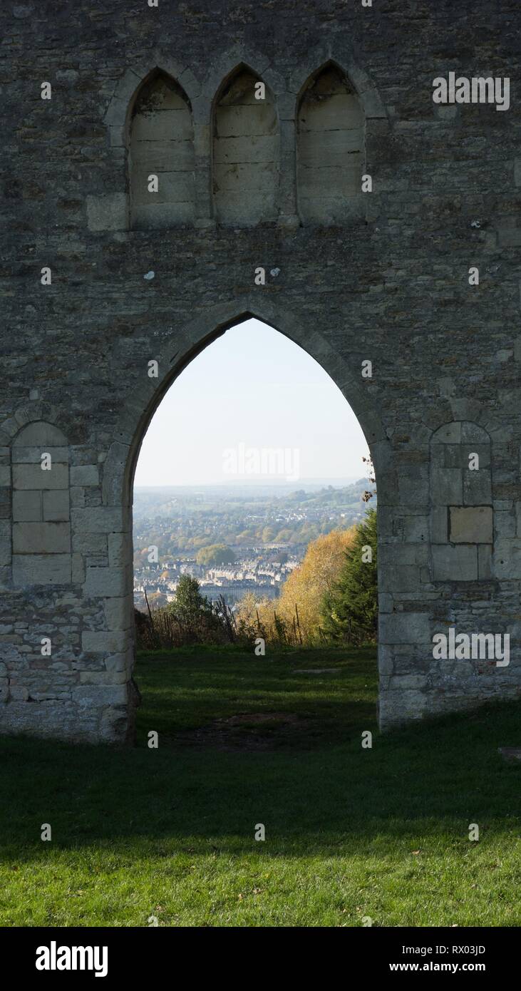 View of the city of Bath through a stone archway, Bath Skyline Walk ...