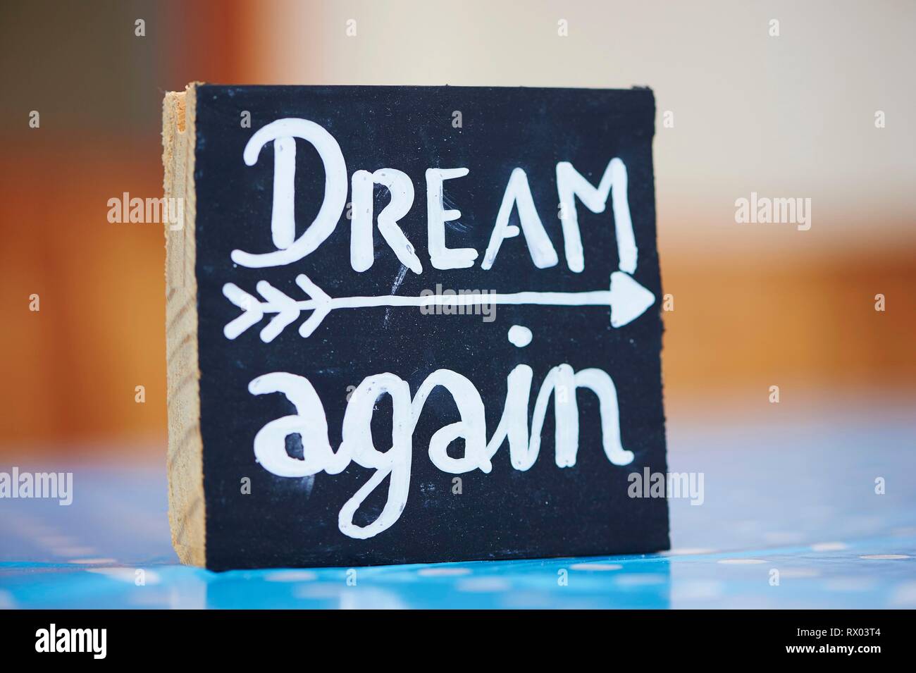 A wood sign with the words dream again, symbol picture, Germany Stock ...