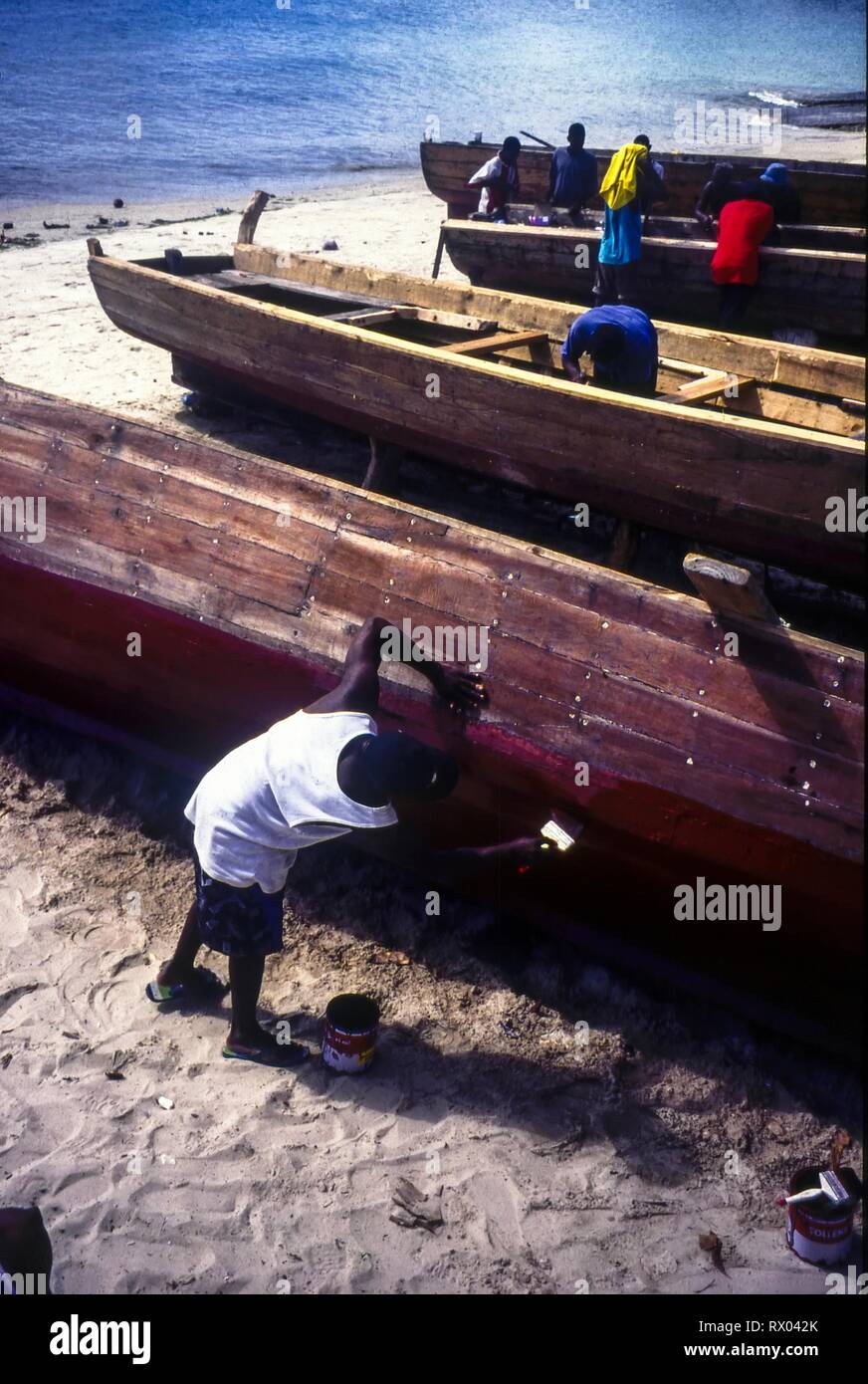 Newly build wooden boats being painted, West of Stone Town, Zanzibar ...