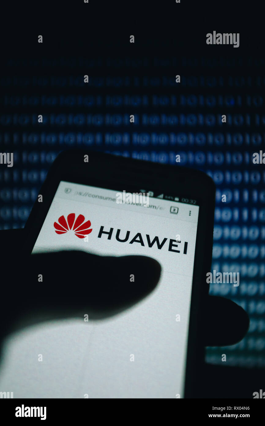 Huawei logo on its website is shown on a smartphone display, white ...