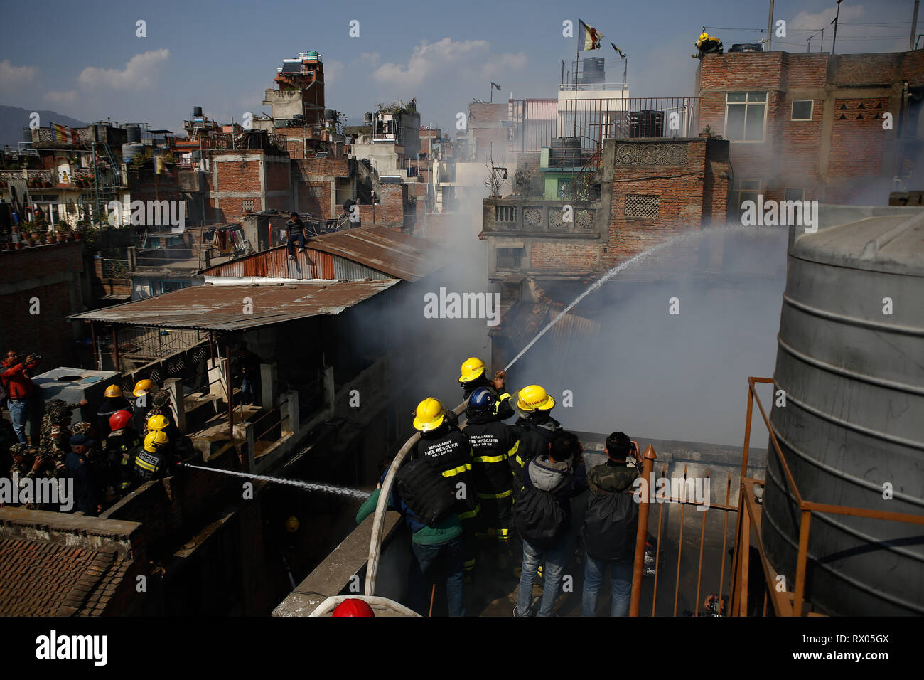 Fire fighters seen working hard to extinguish the fire. Fire broke out ...
