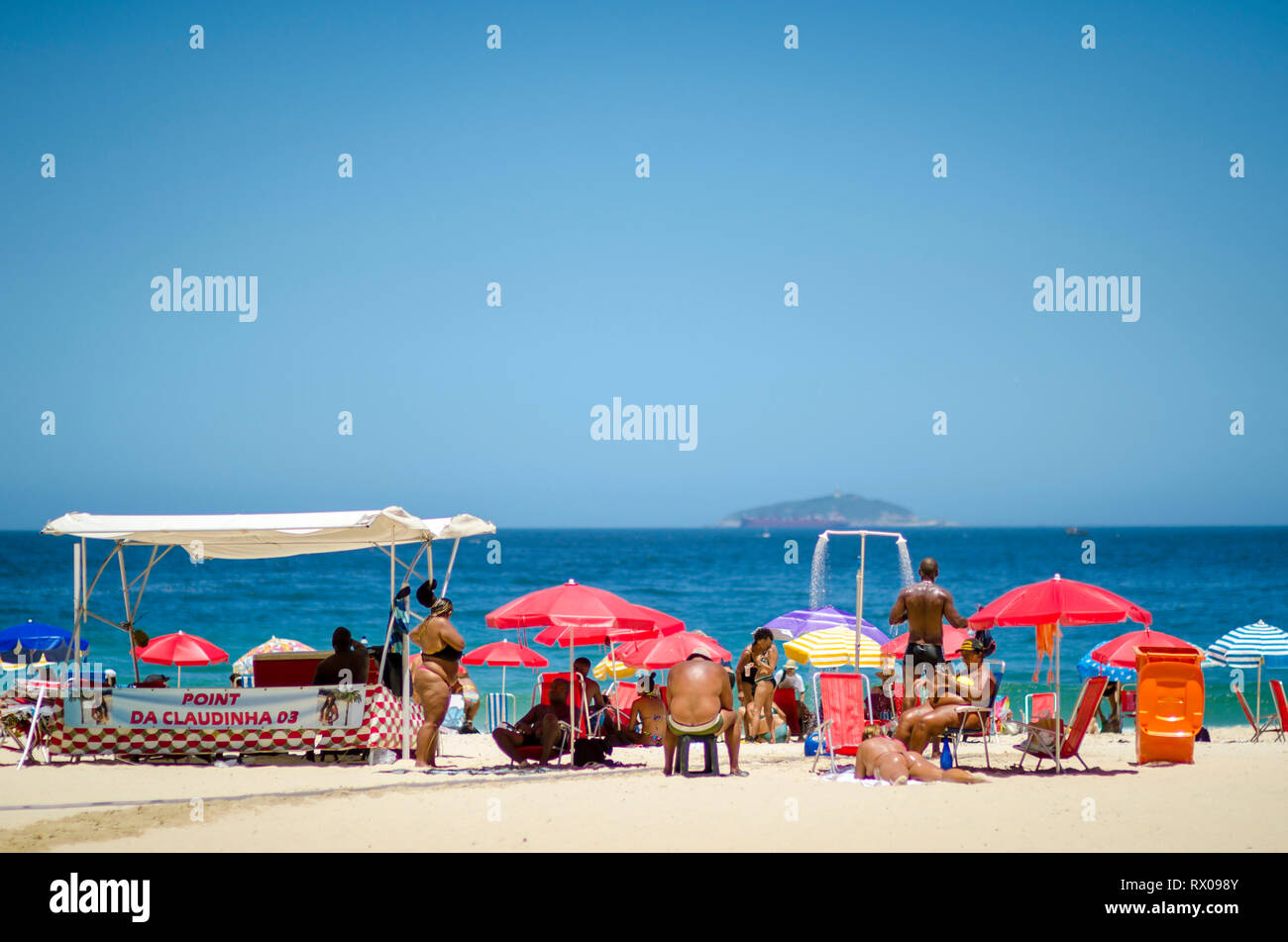 RIO DE JANEIRO - FEBRUARY 10, 2017: Beachgoers take in the midday ...