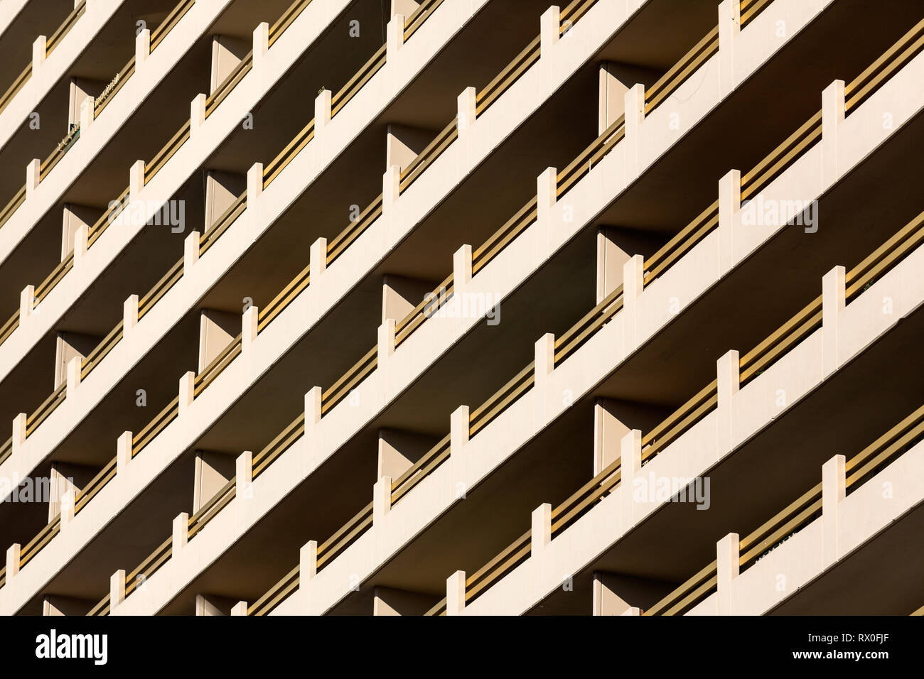 A section of a tall building with many floors stacked up in a diagonal ...