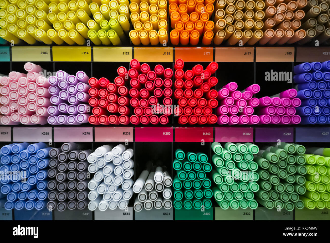 Different rainbow markers or pens on the shelfs at art store Stock ...