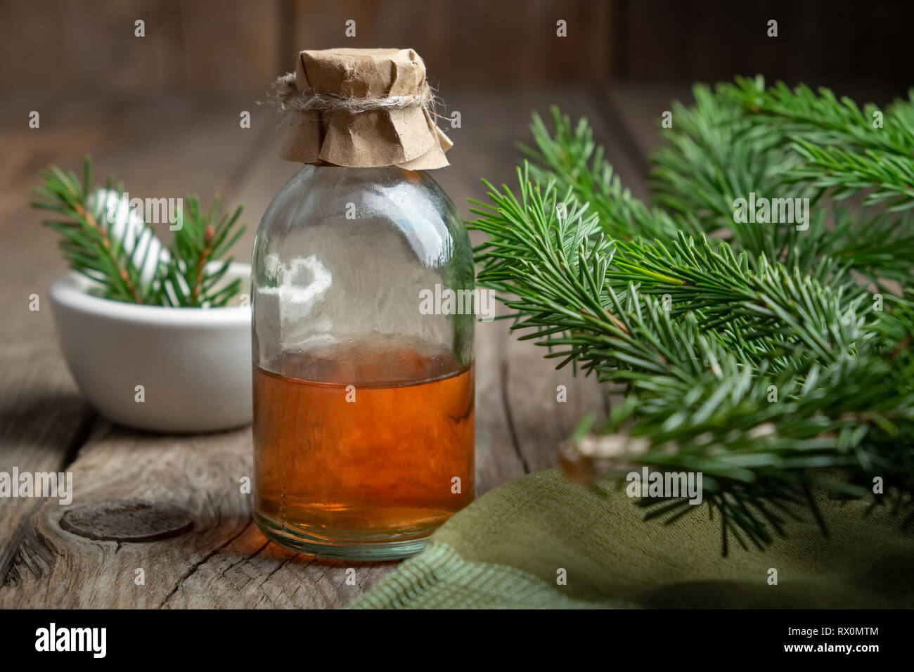 Fir aromatic oil. Pine essential oil in a transparent glass bottle ...