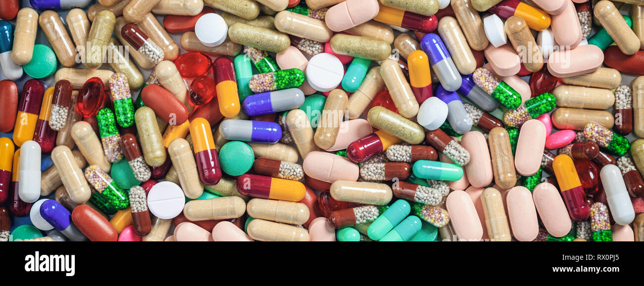 Medicine, medication. Colorful pills and capsules background, banner ...