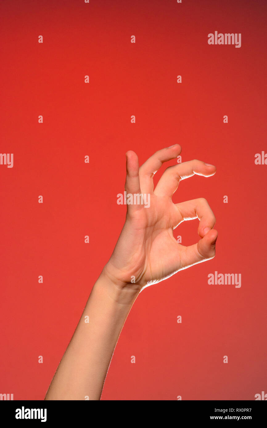 The human hand shows the sign ok symbolizing the positive, isolated on ...