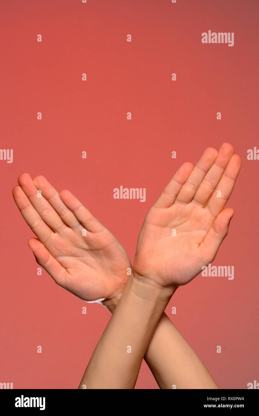 Human hands folded crosswise, which symbolize the wings of a bird or ...
