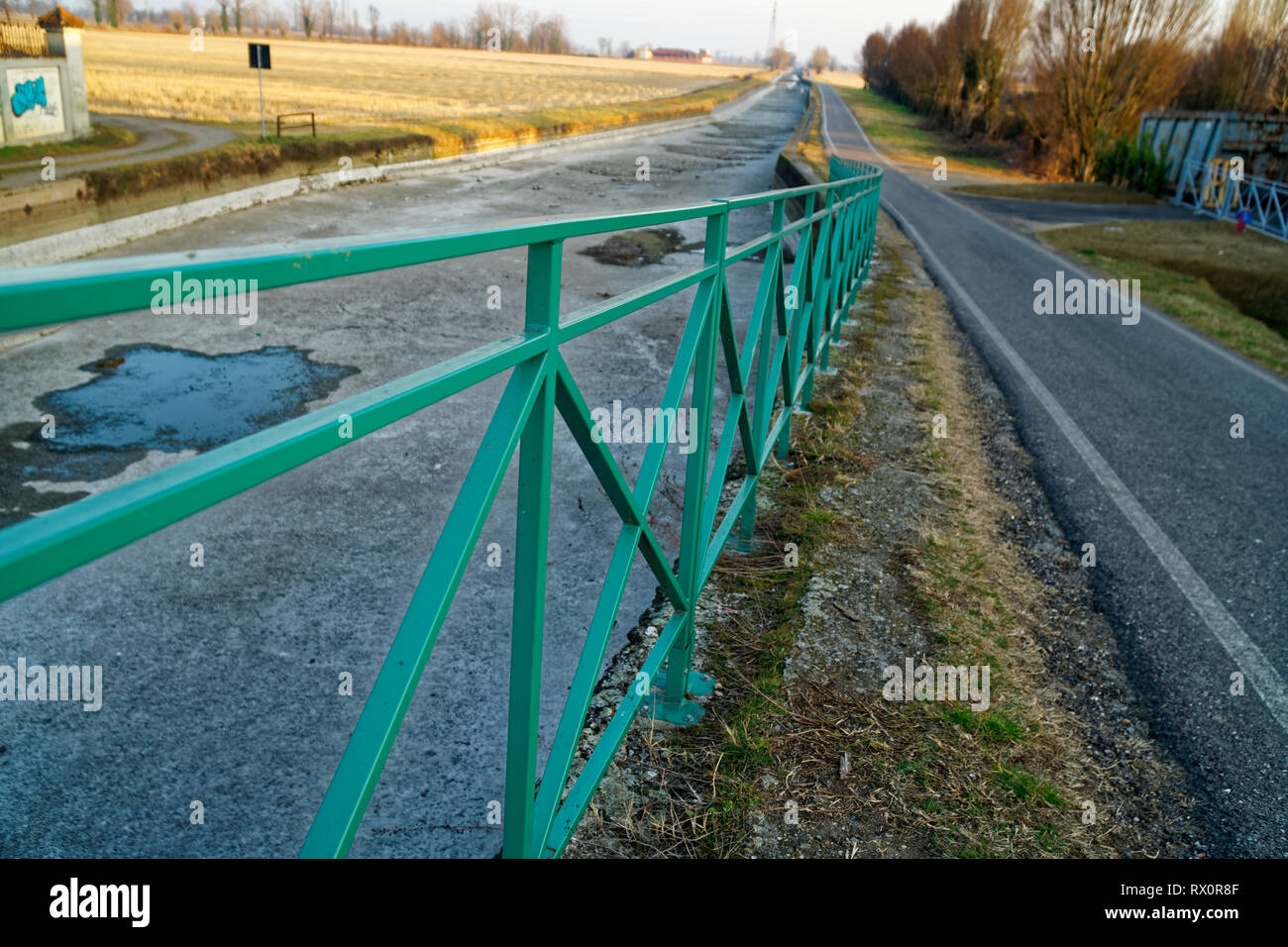 Empty running road near dry water canal Stock Photo - Alamy