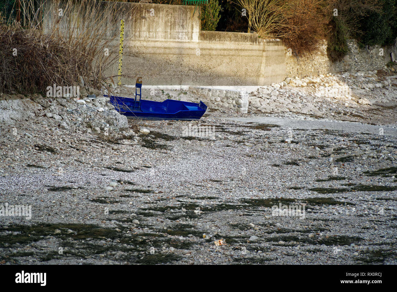 River drought, blue boat without water due global warming Stock Photo ...