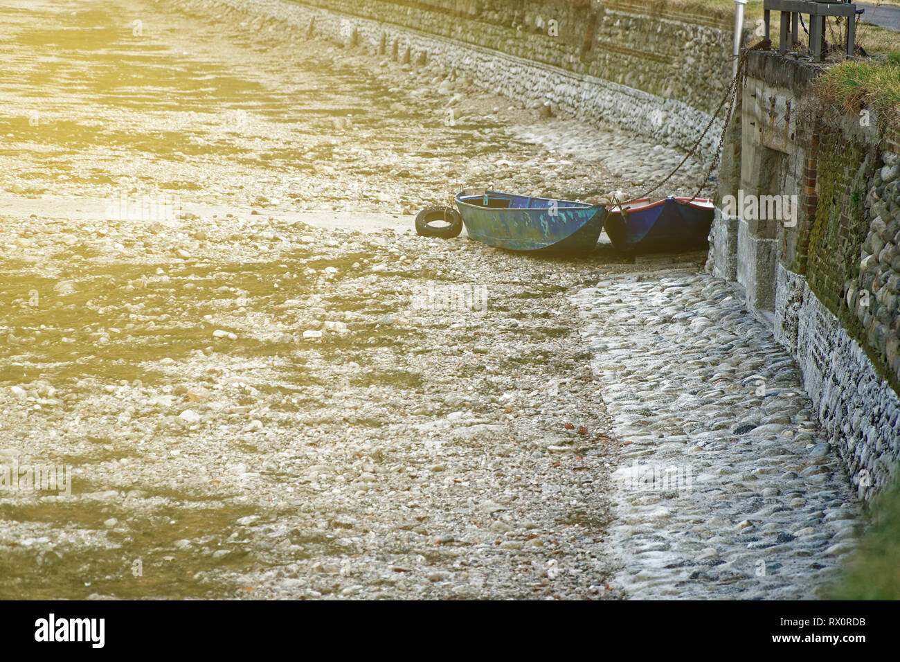 Two boat in River drought, blue boat without water due global warming ...