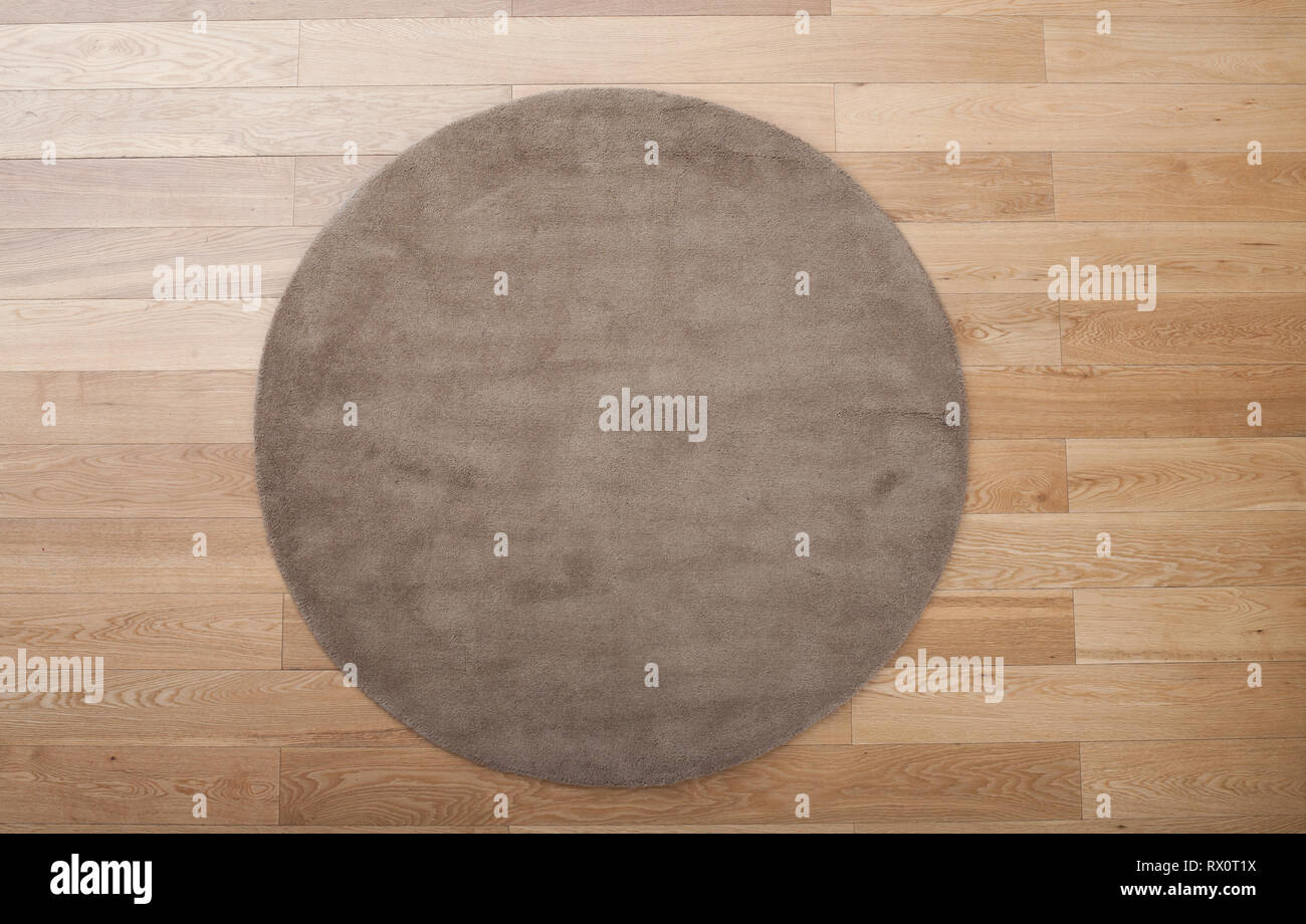 round mat in a living room floor Stock Photo - Alamy