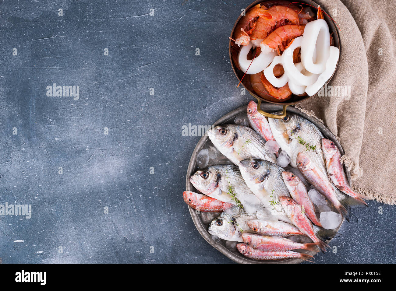 raw fish on a gray stone background. Fresh food for dietetic food ...