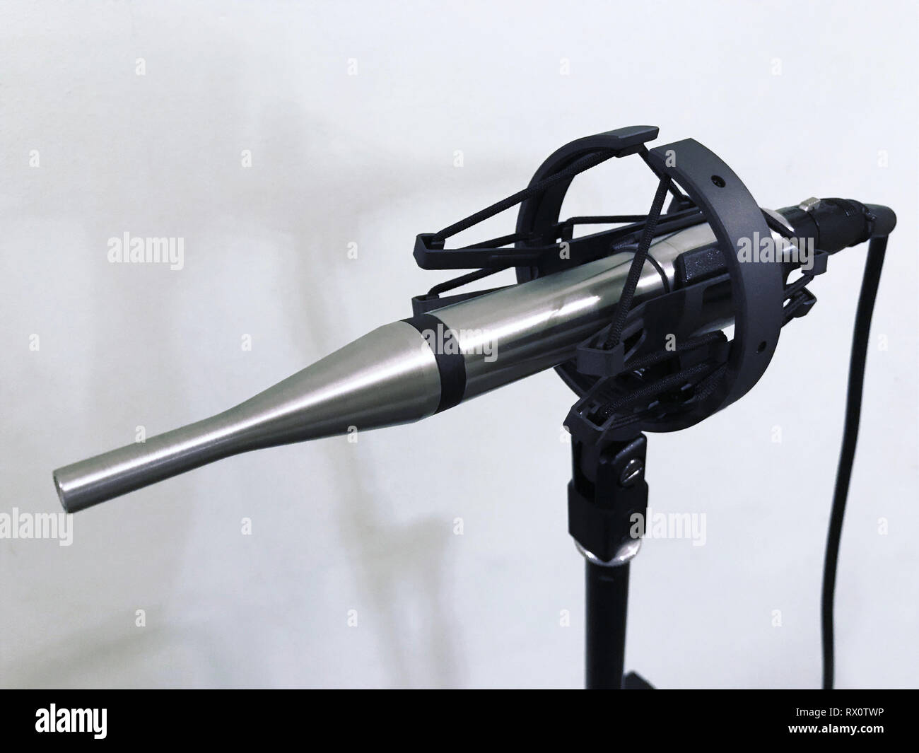 Measuring microphone at sound studio on white background Stock Photo ...