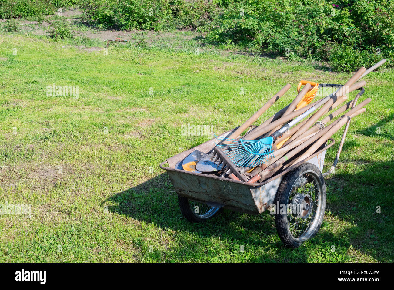 Wooden wheel barrow hi-res stock photography and images - Alamy