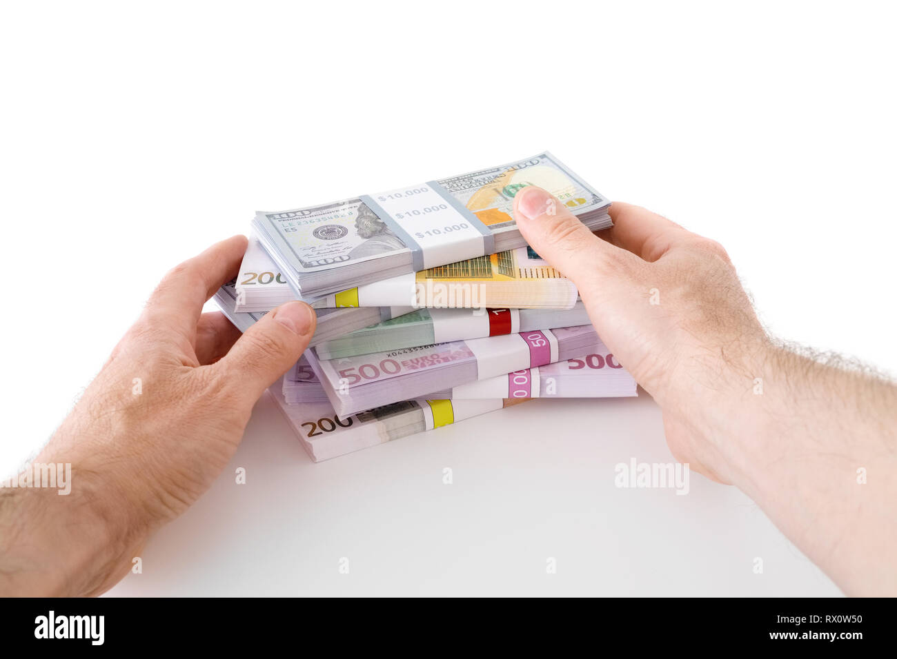 Hands with banknotes of dollars and euro on white Stock Photo - Alamy