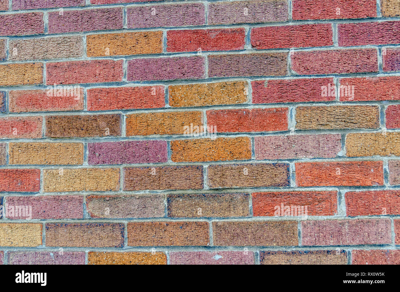 A close-up of a Multicolored brick wall Stock Photo - Alamy
