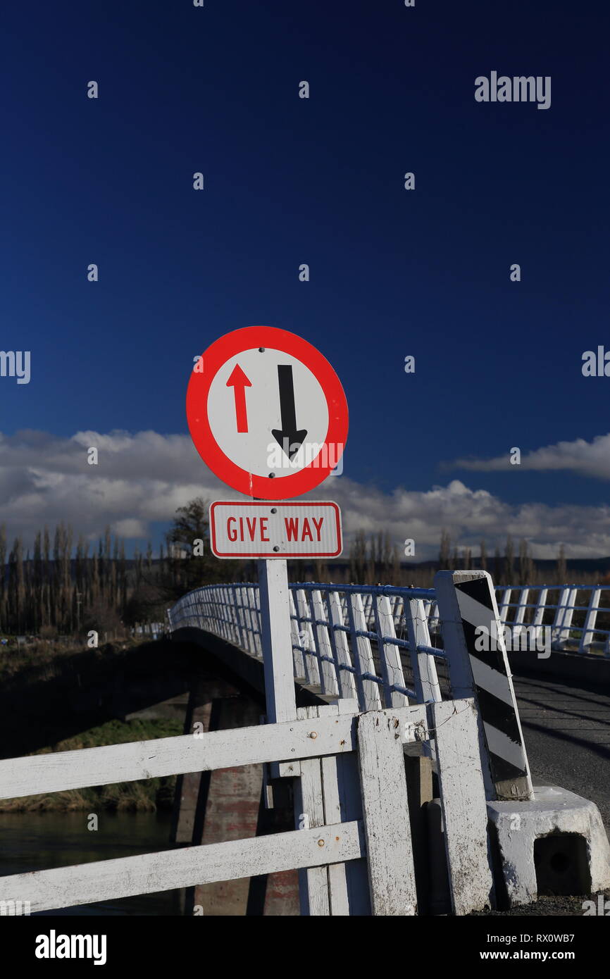 Give Way sign on single lane bridge Stock Photo - Alamy