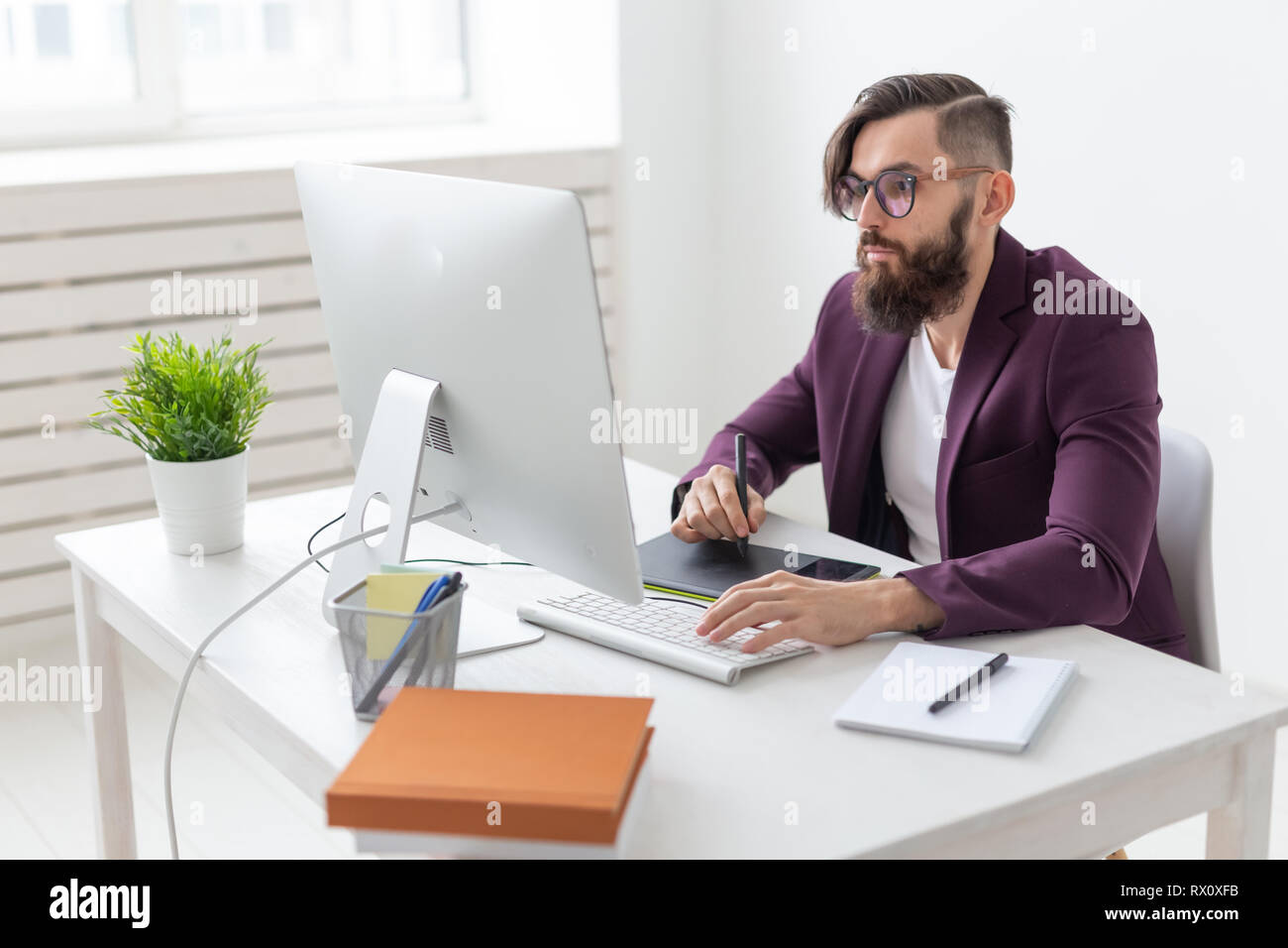 people, design and style concept - graphic designer sketching new ...