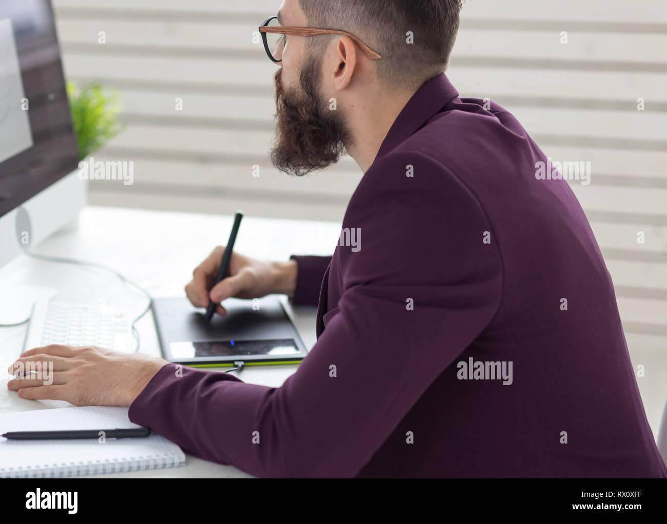 people, design and style concept - graphic designer sketching new ...