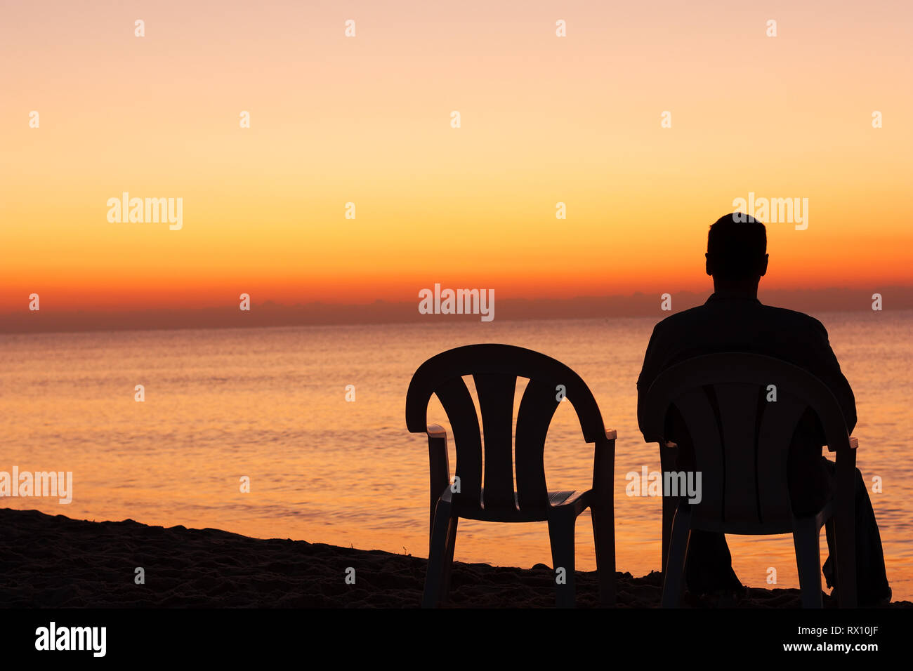 Sunrise people silhouette sitting hi-res stock photography and images ...