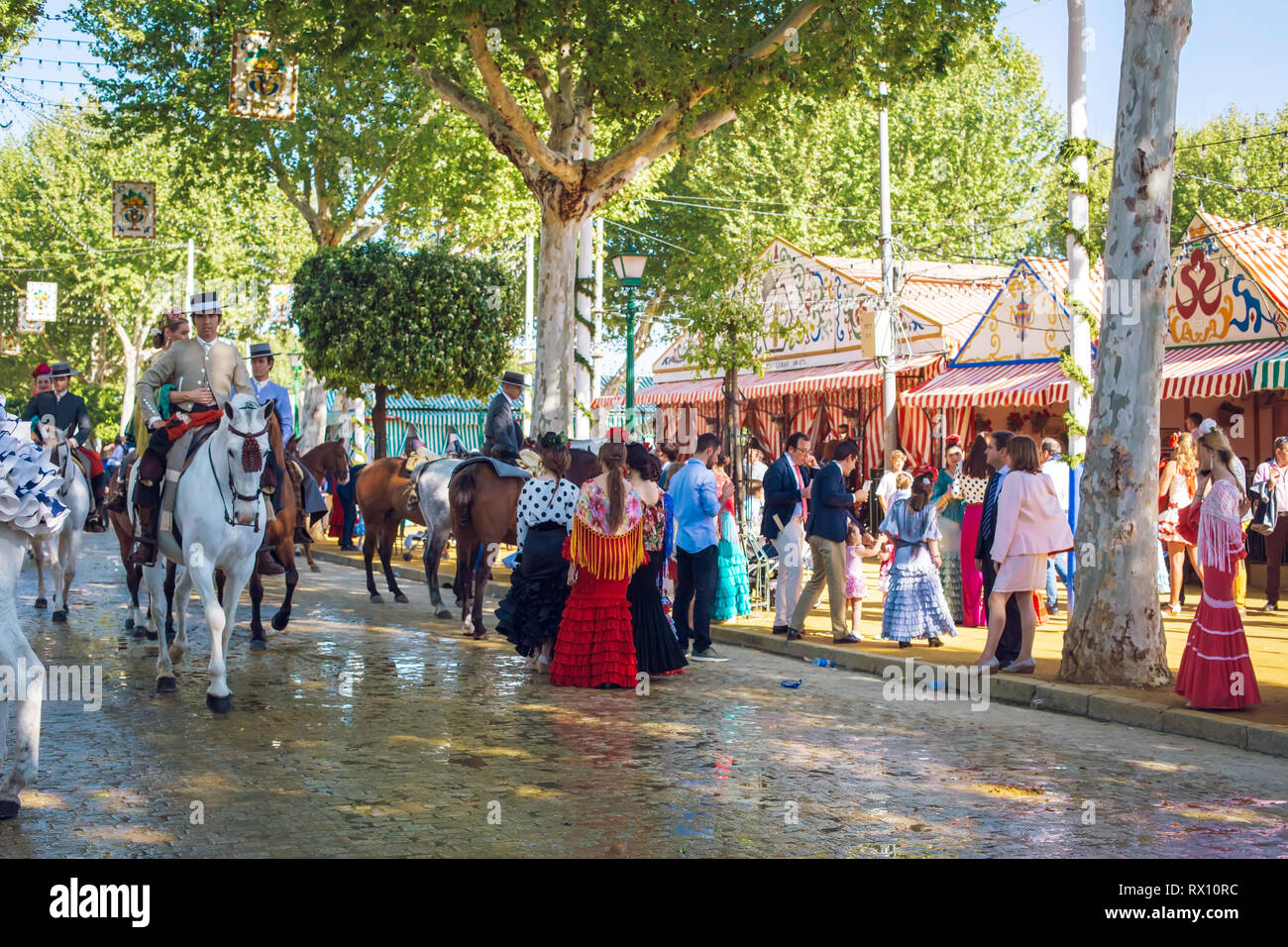 Riders and People dressed in traditional costumes enjoy April Fair ...