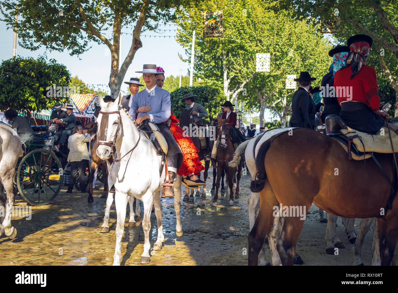 Group of riders on horseback enjoy April Fair, Seville Fair (Feria de ...