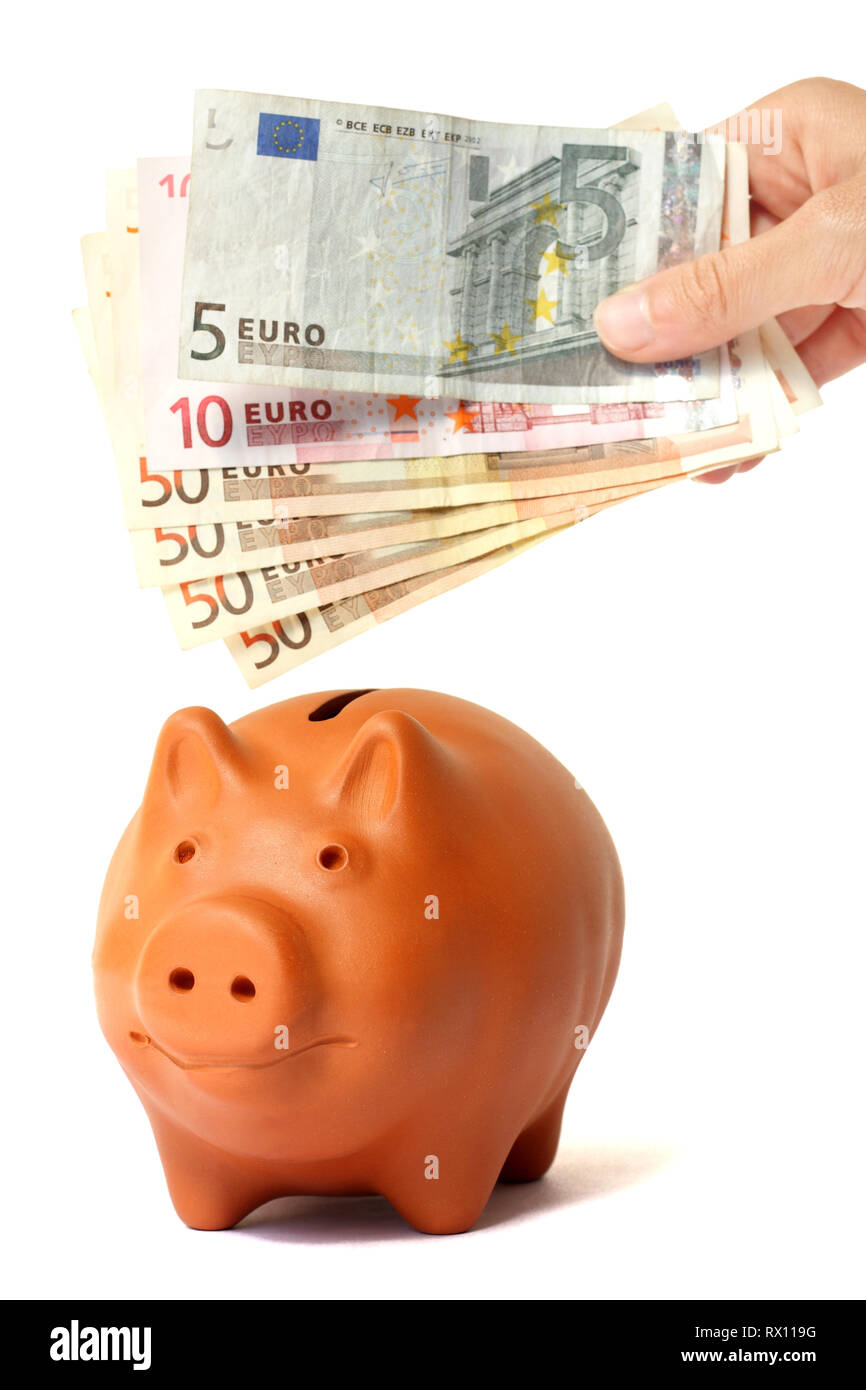 Coin money box hand Cut Out Stock Images & Pictures - Alamy