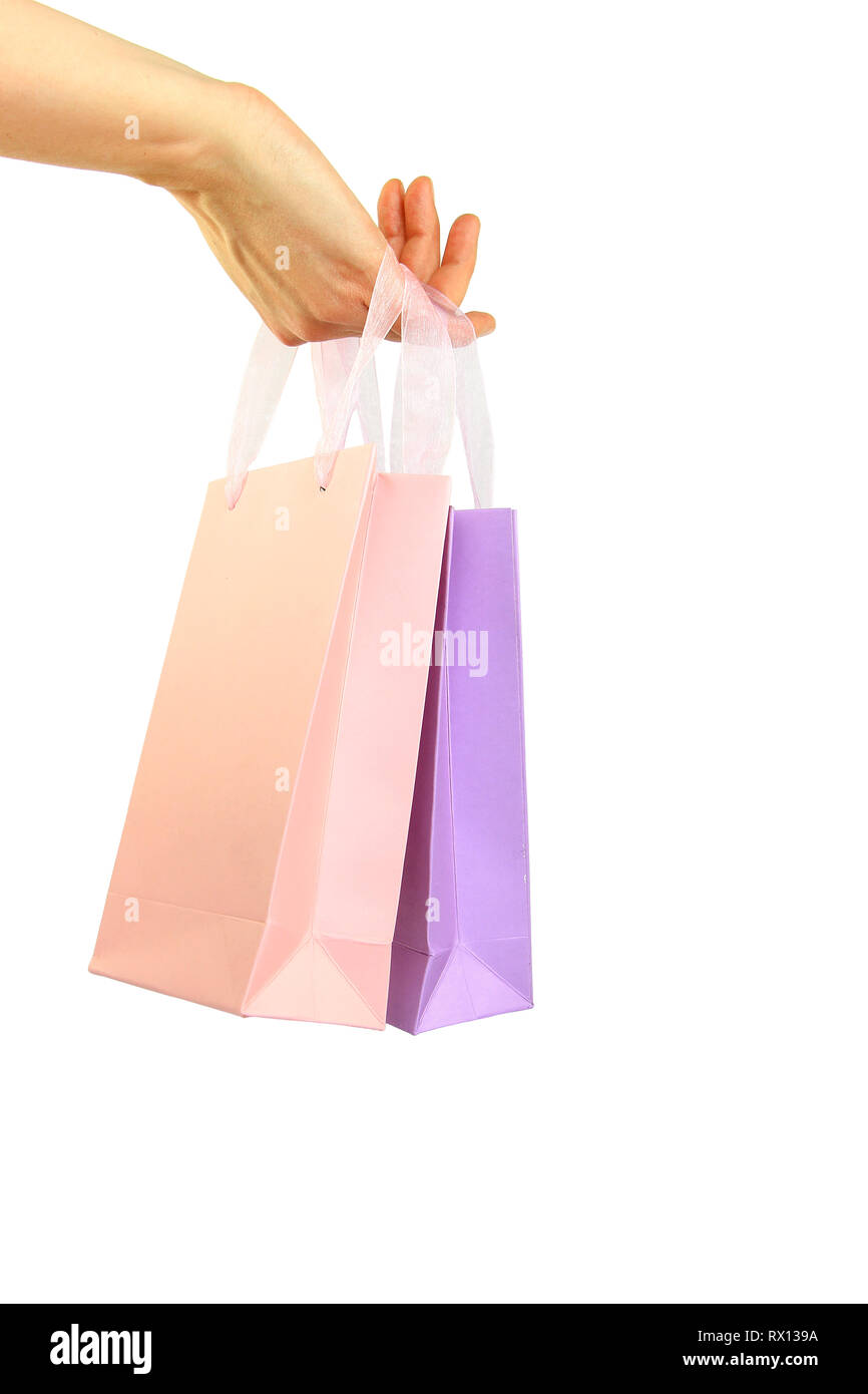 Hand holding colorful shopping bags isolated on white Stock Photo - Alamy