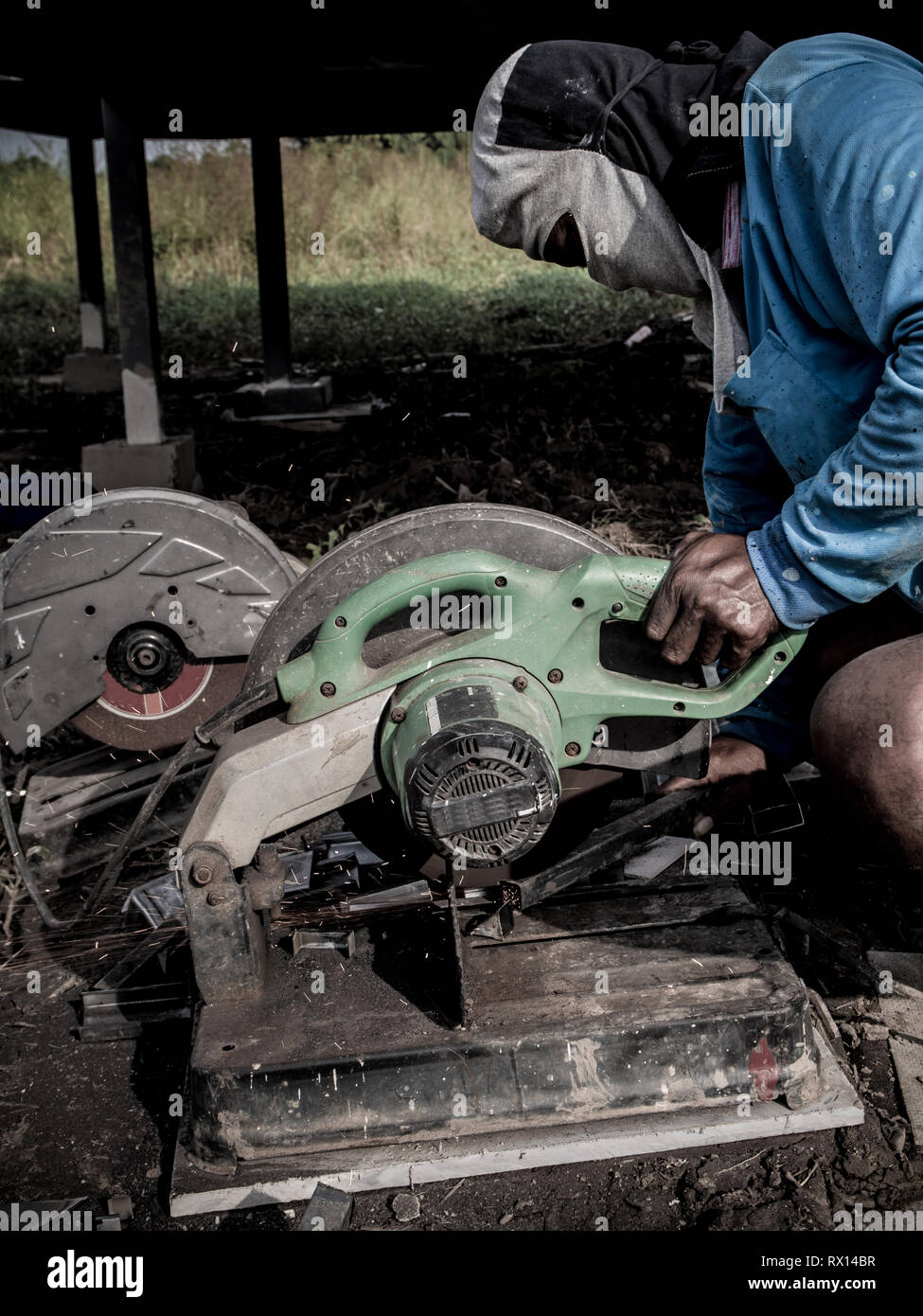 Cutting man in light hi-res stock photography and images - Alamy