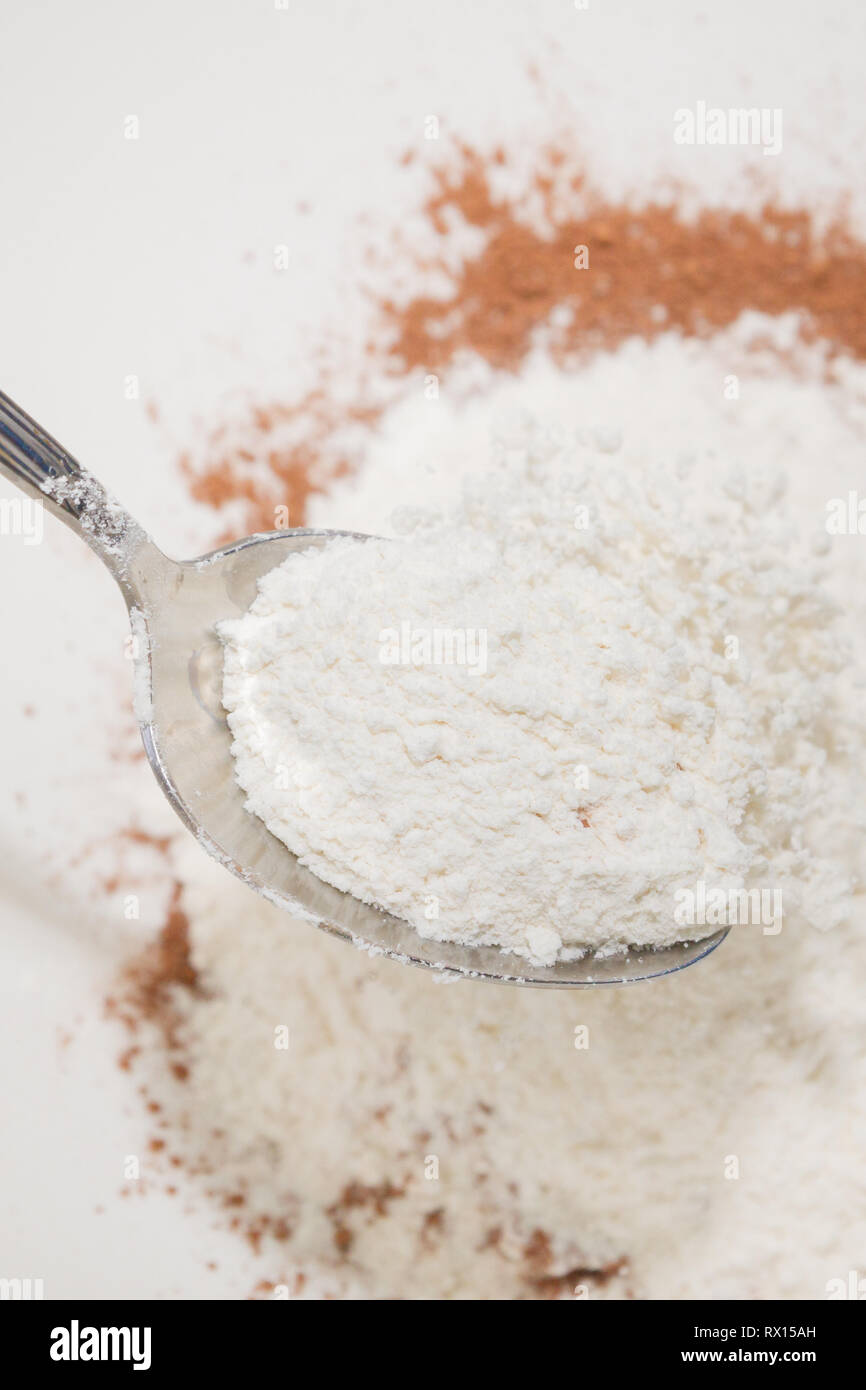 The flour is mixed with dry cocoa powder in a mixing bowl Stock Photo ...