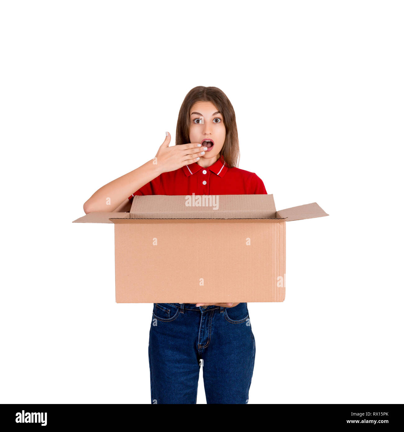 Young delivery woman is making a surprise gesture isolated on white ...