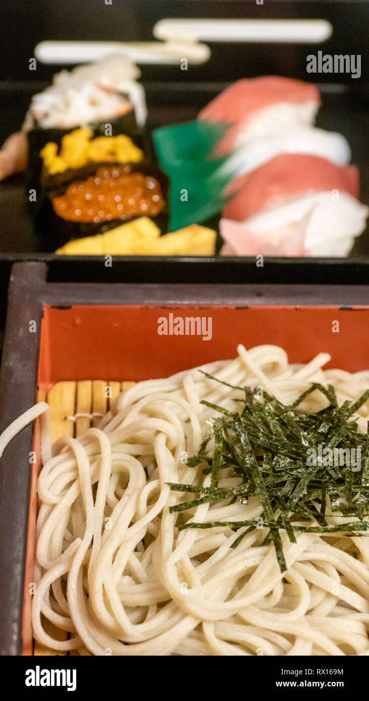 Japanese soba noodles, sashimi and nori-wrap sushi platter Stock Photo ...