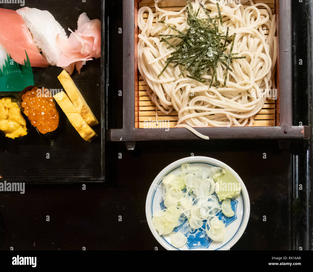 Japanese soba noodles, sashimi and nori-wrap sushi platter Stock Photo ...