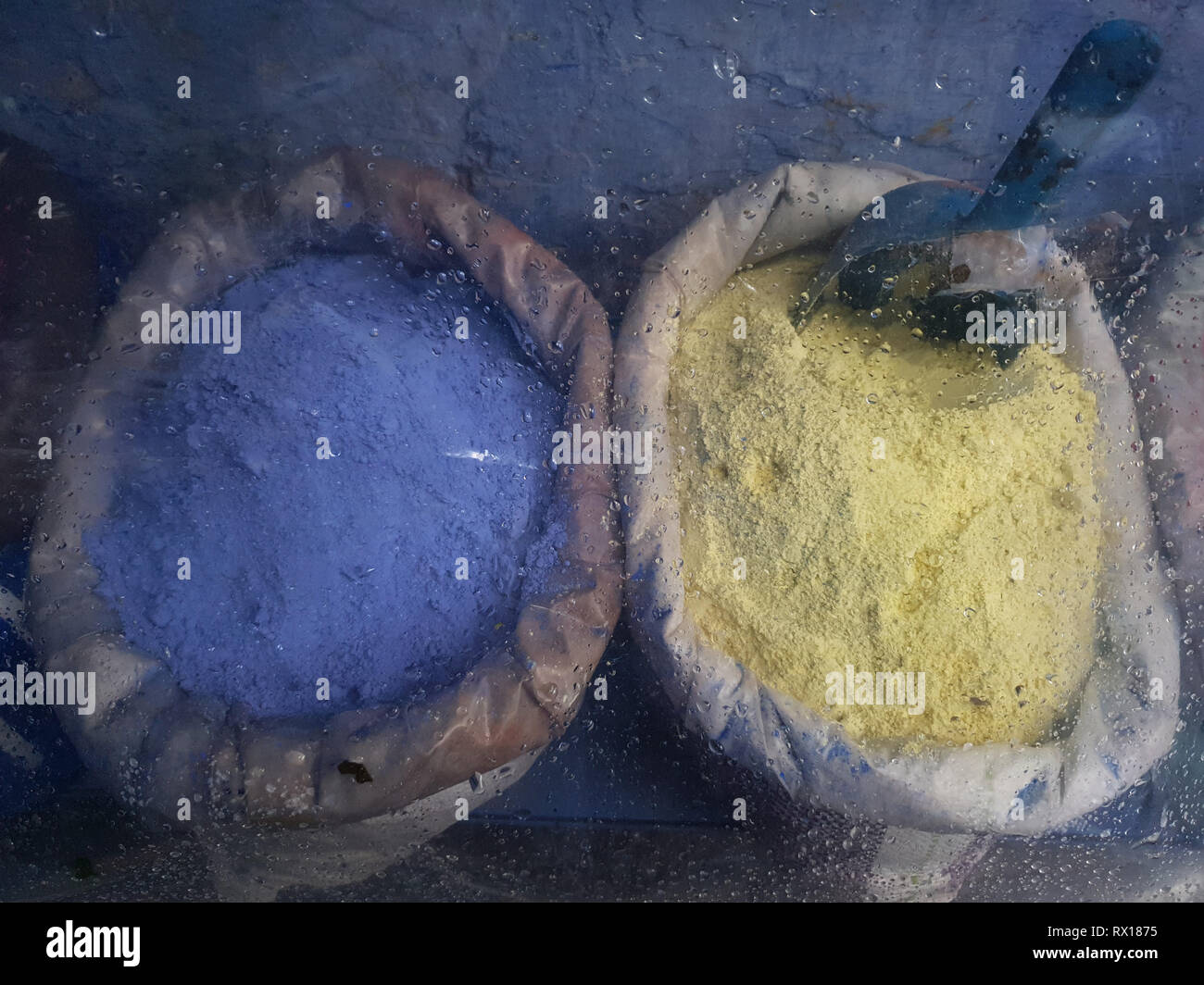 Bright blue and yellow paint in bags, Chefchaouen medina, Morocco Stock ...
