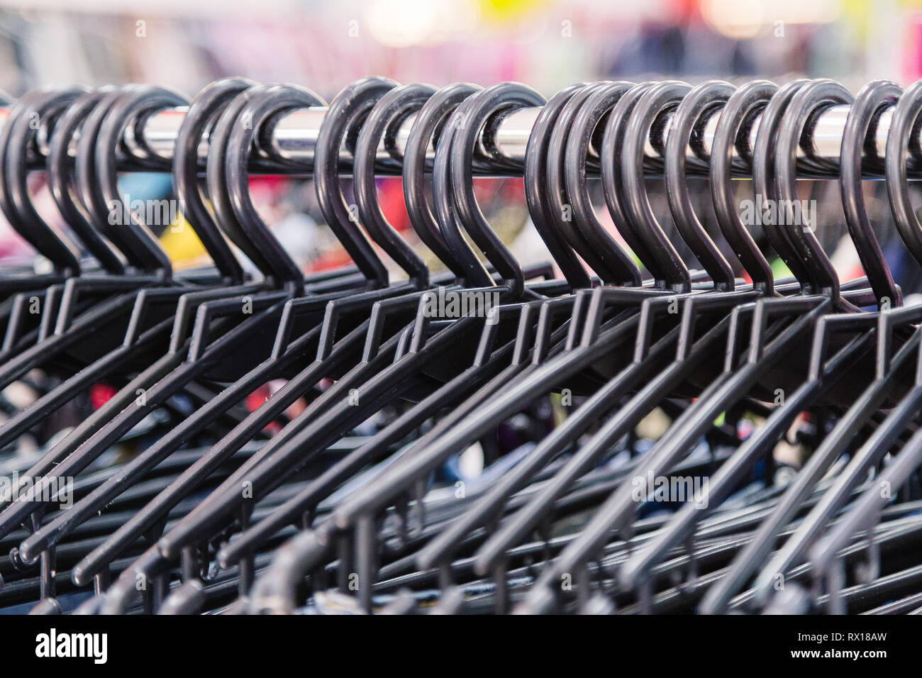 modern hanger hanging on a clothes rack with grey background. Retail ...