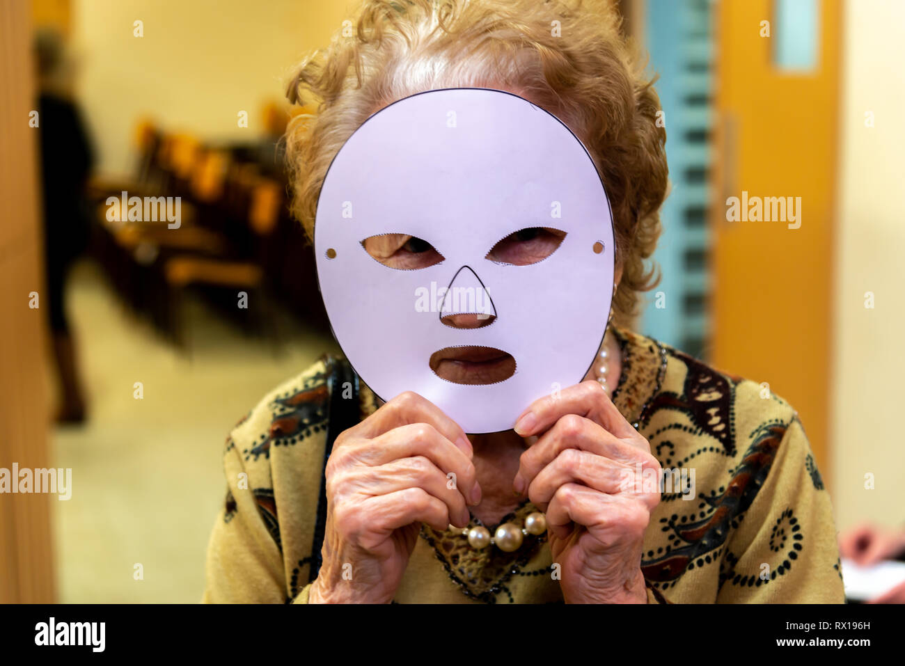 Old women with the mask Stock Photo - Alamy